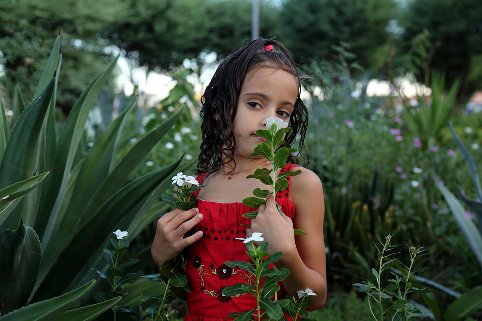 Girl Smelling A Flower In The - Free photo on Pixabay - Pixabay