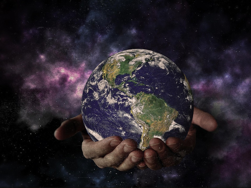 God Holding His Hands In The World